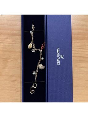 Swarovski | Jewelry | New Swarovski Ocean Charm Bracelet Gold Tone ...